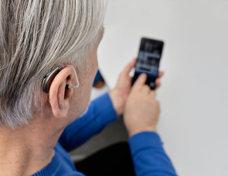 How to change hearing aid volume and programs - TruHearing